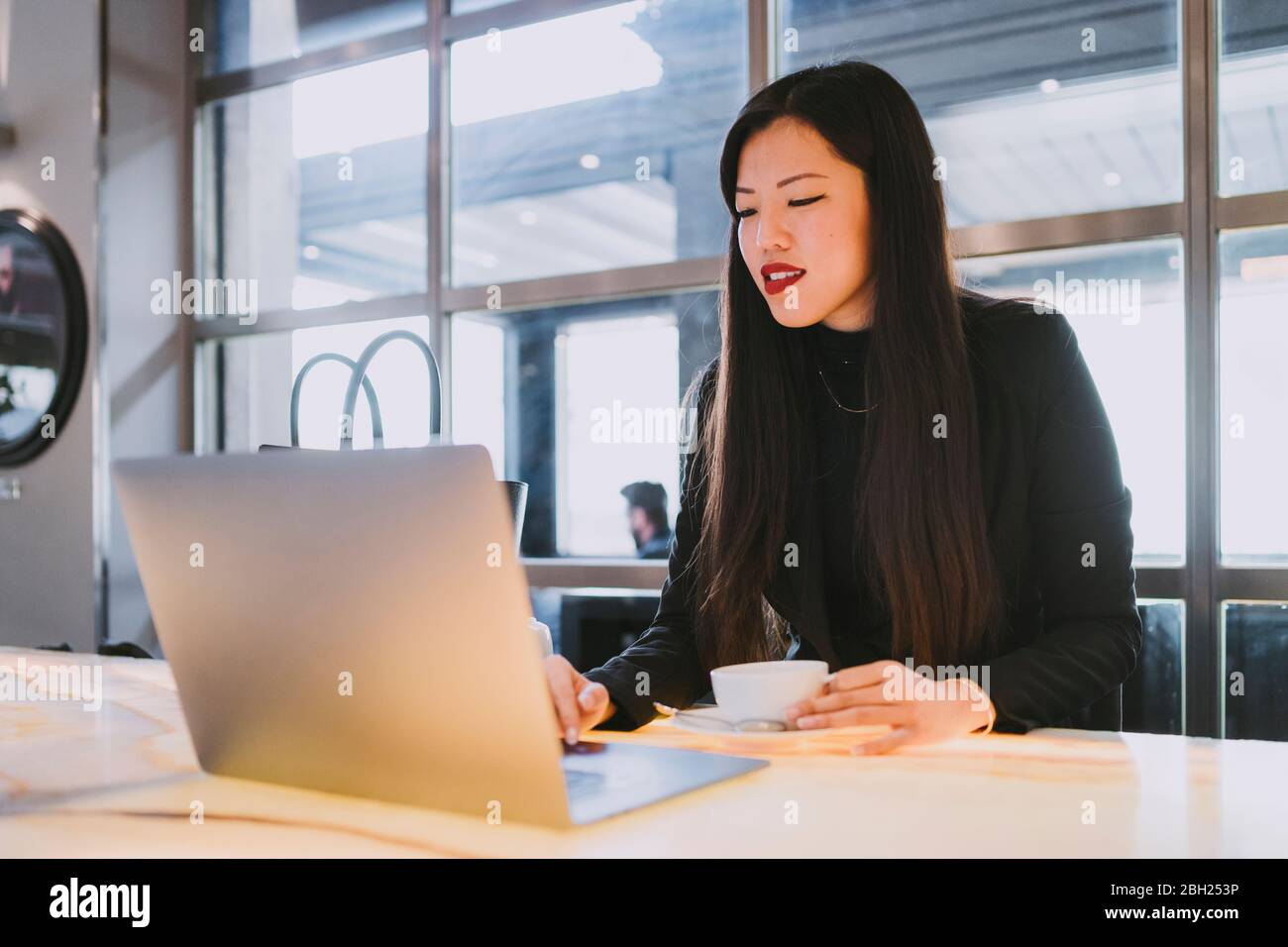 Attractive black businesswoman using hi-res stock photography and ...