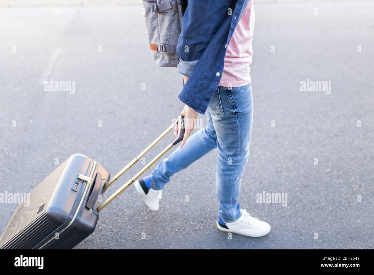 Man pulling trolley hi-res stock photography and images - Alamy
