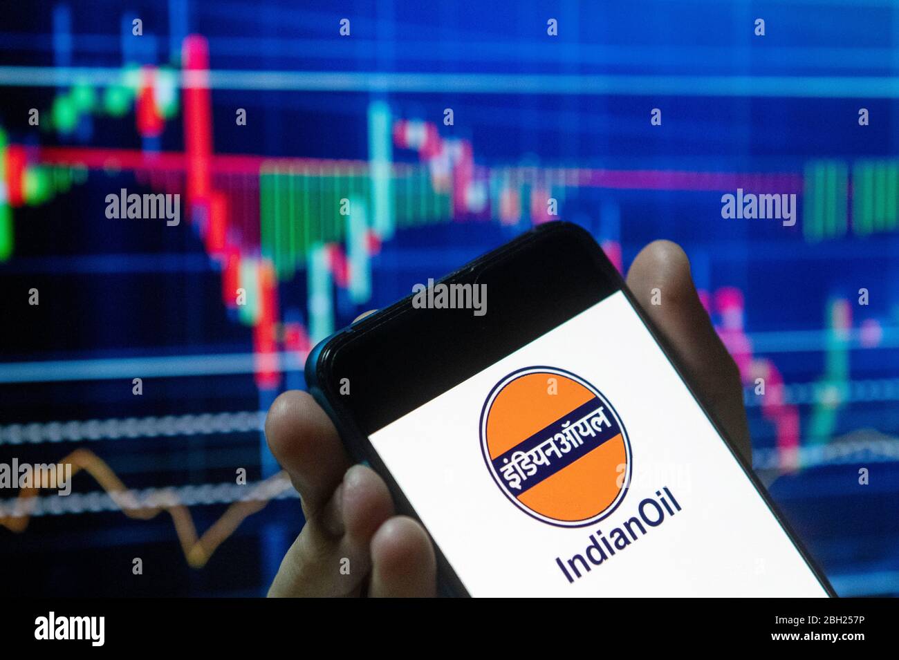 In this photo illustration an Indian Oil logo seen displayed on a ...