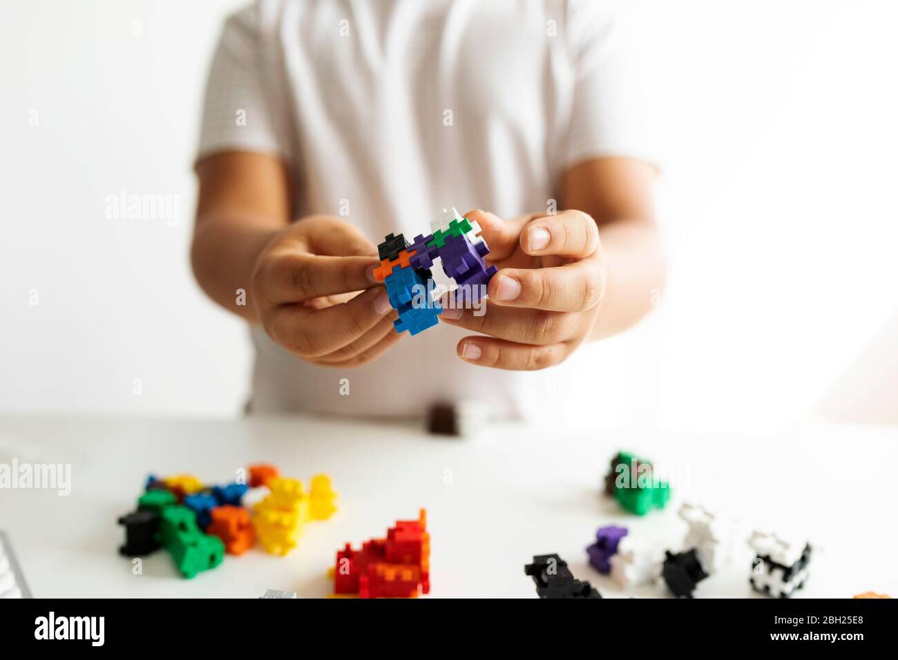 Children hands blocks hi-res stock photography and images - Alamy