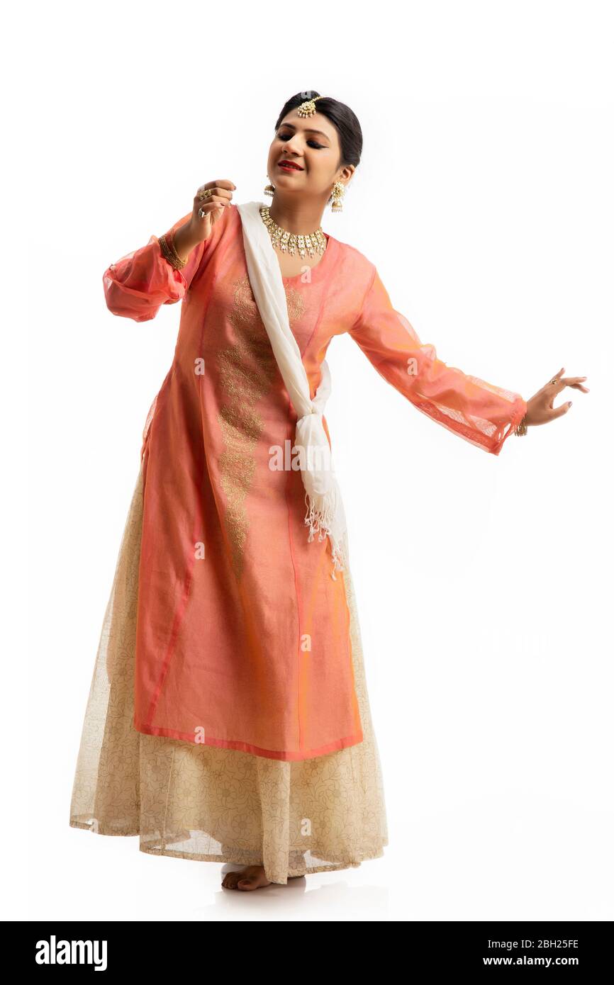 Beautiful kathak dancer performing over a white background Stock Photo ...