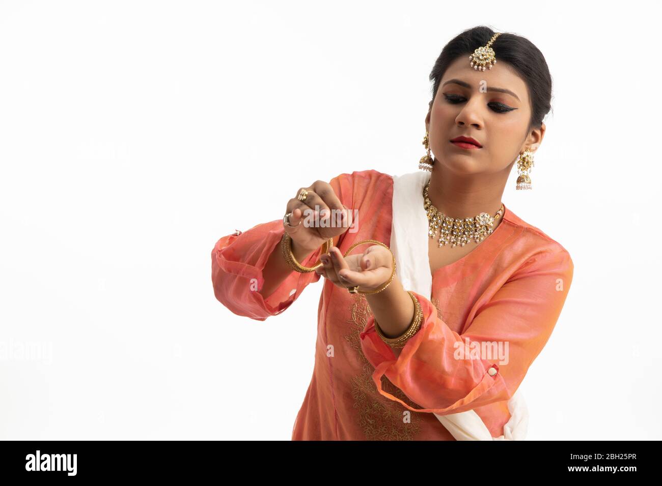 Beautiful kathak dancer performing over a white background Stock Photo ...