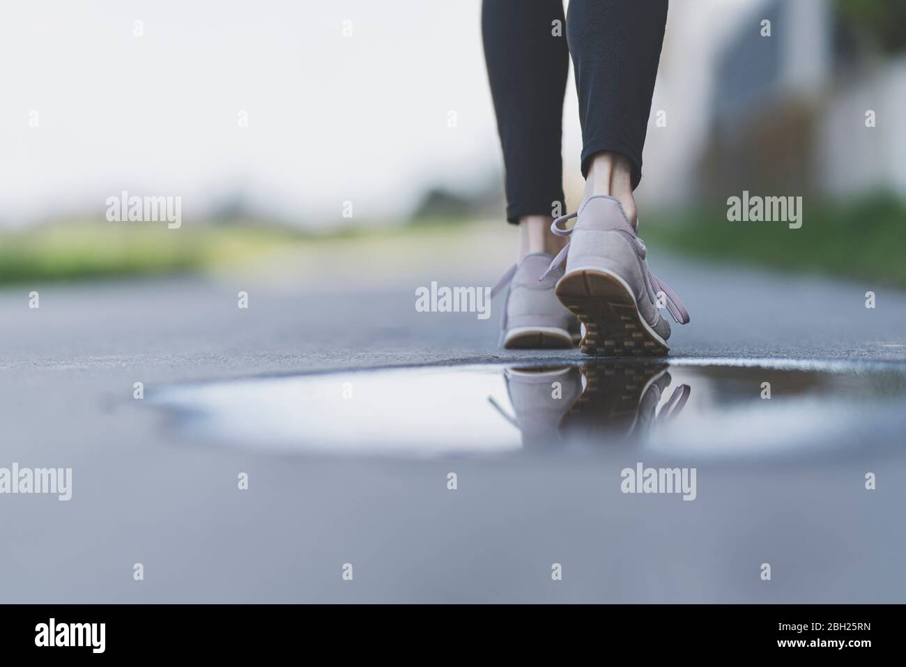 Mirroring running shoes puddle hi-res stock photography and images - Alamy