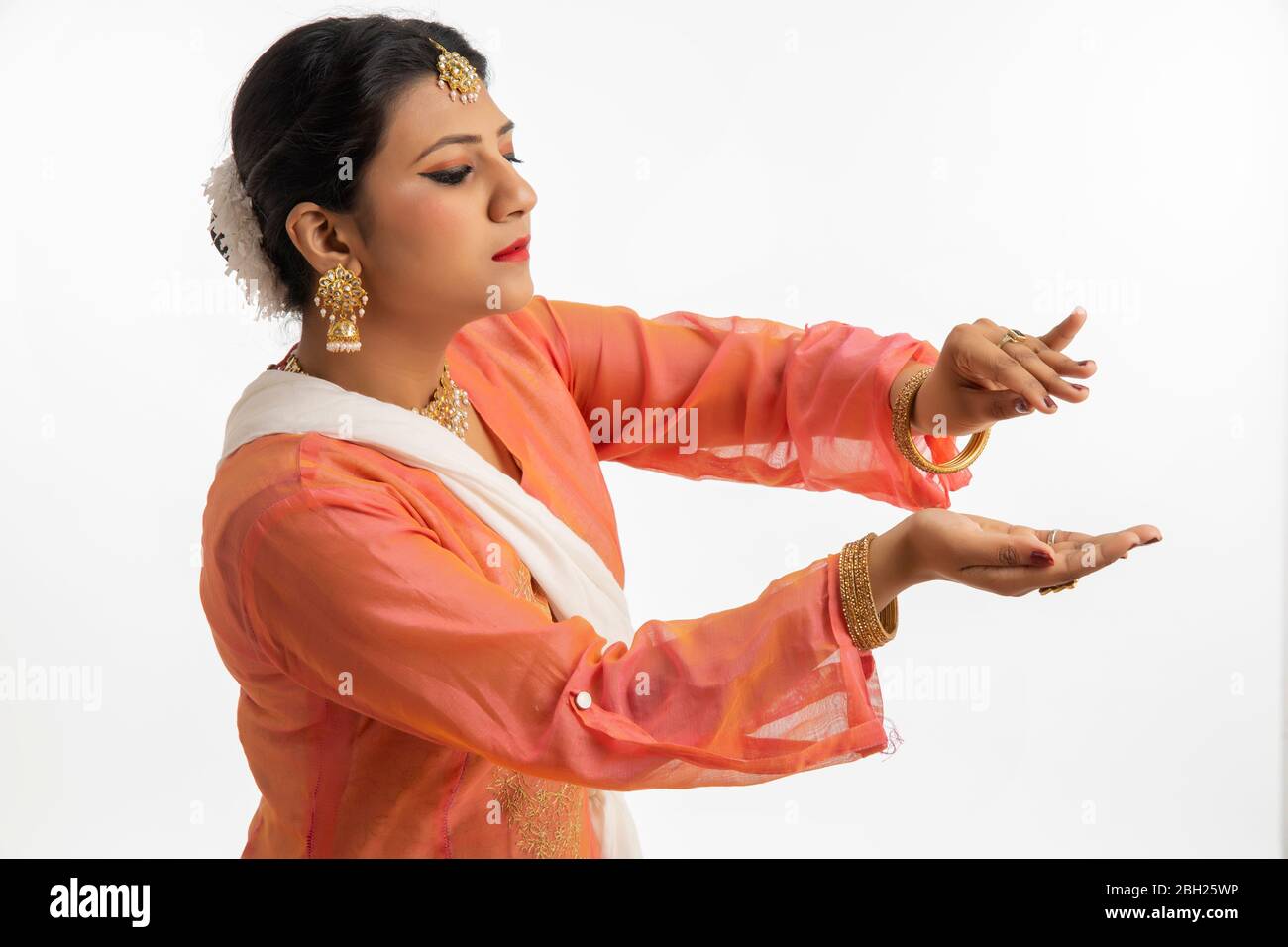 Graceful kathak dancer performing over a white background Stock Photo ...