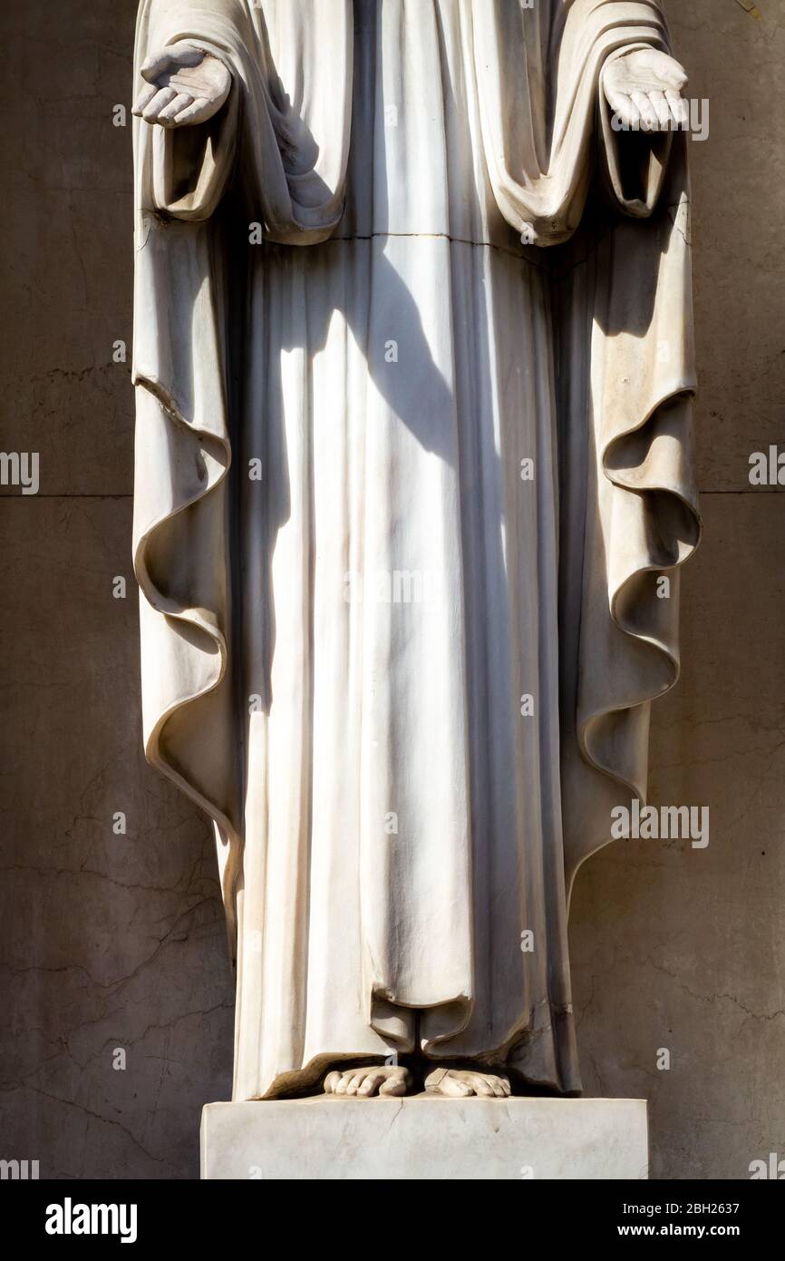 Hands of a stone statue outstretched in blessing Stock Photo - Alamy