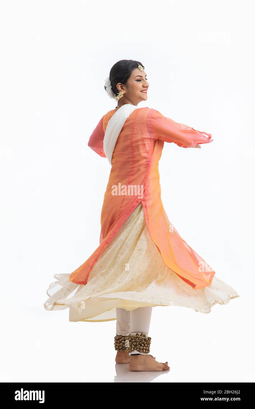 Beautiful kathak dancer circling in front of a white background Stock ...