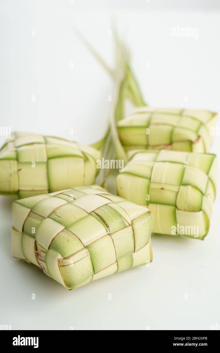 ketupat rice cake close up over white background Stock Photo - Alamy