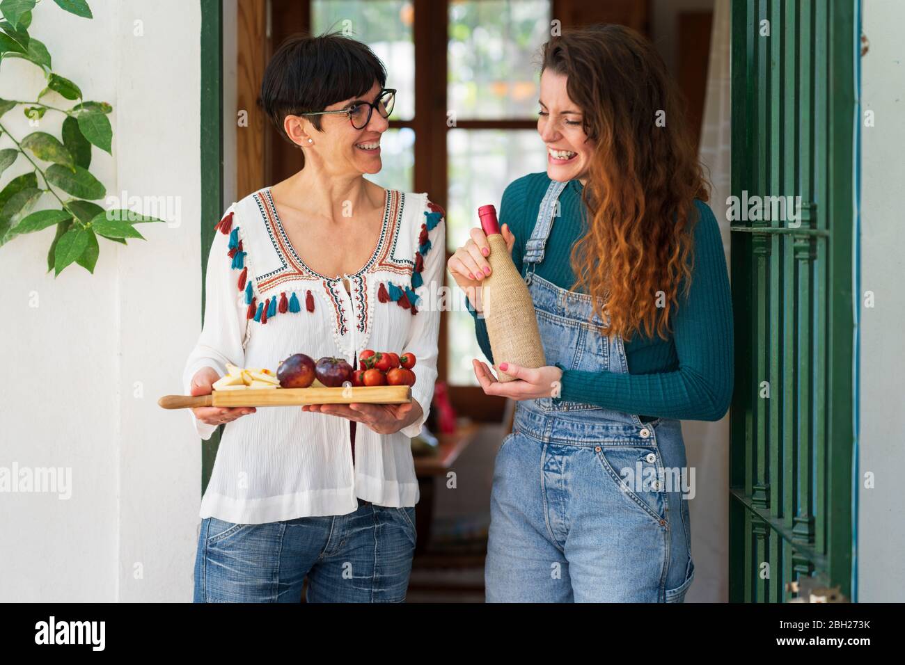 Women bringing food hi-res stock photography and images - Alamy