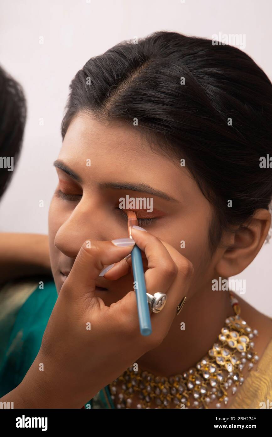 Kathak dancer getting makeup applied on her face Stock Photo - Alamy