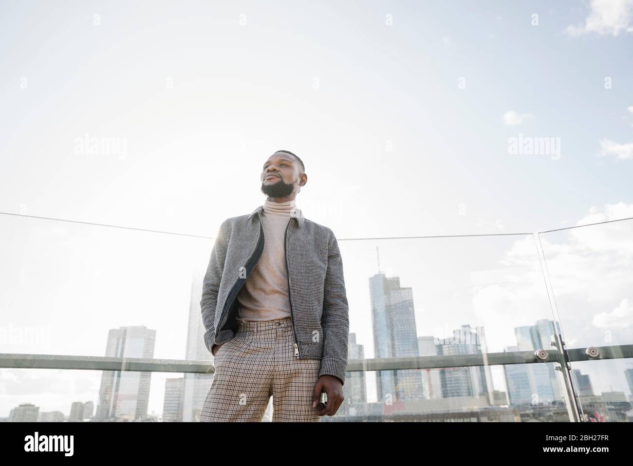 Stylish man standing on observation terrace skycraper view hi-res stock ...