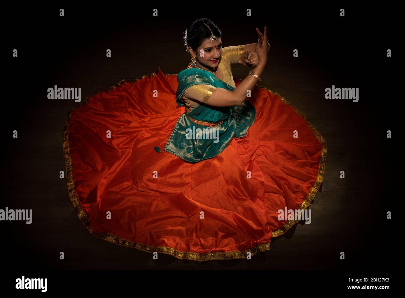 Kathak dancer sitting gracefully on the floor Stock Photo - Alamy