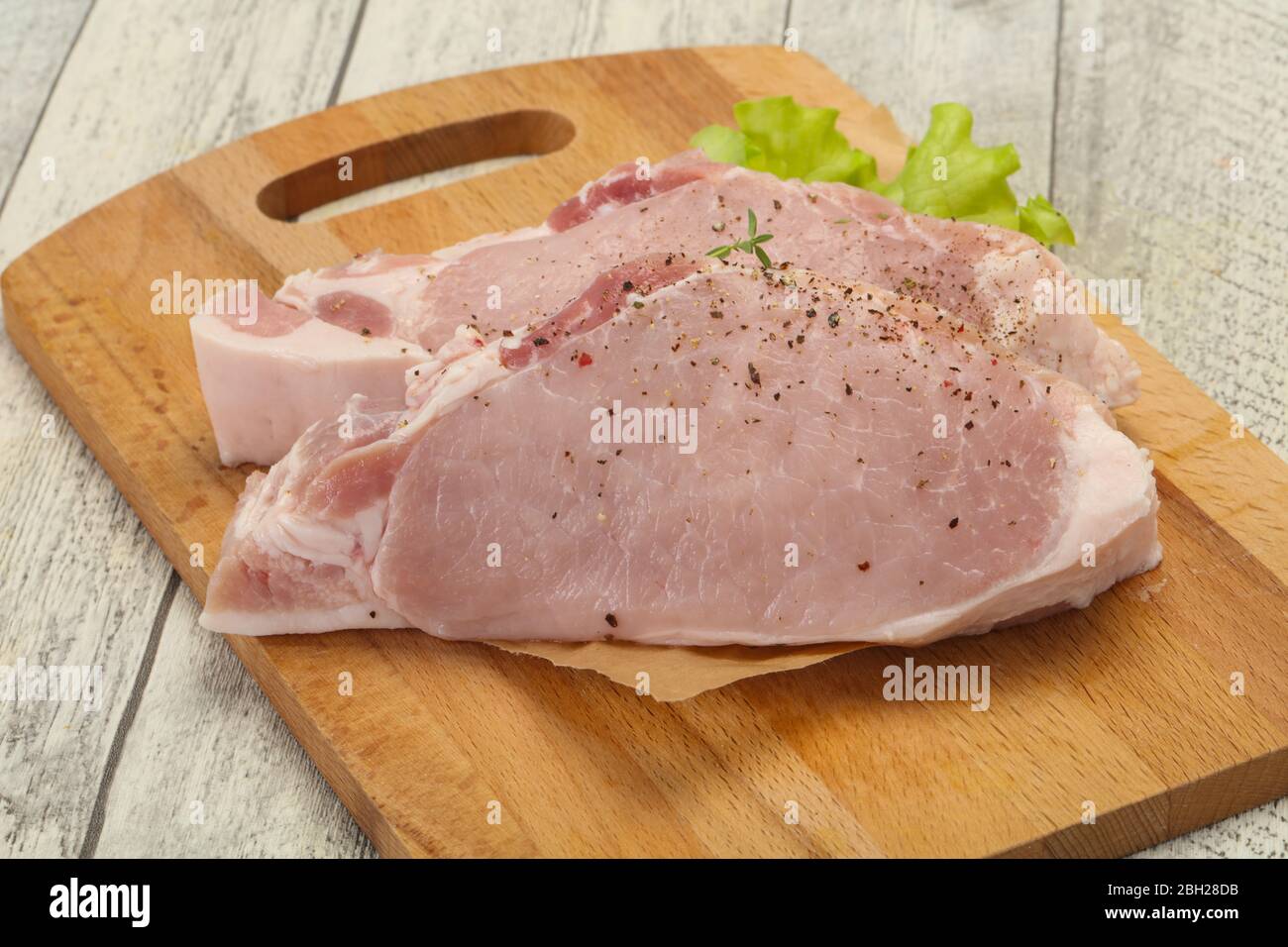 Raw pork meat steak ready for grill Stock Photo - Alamy