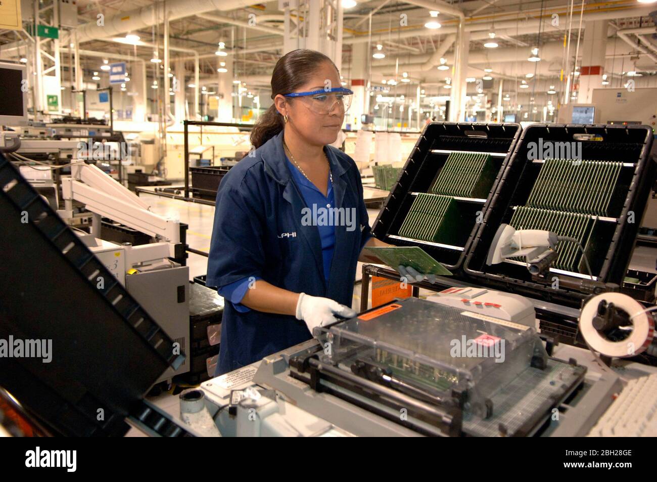Matamoros, Mexico: April, 2006. Female worker making car radios at ...