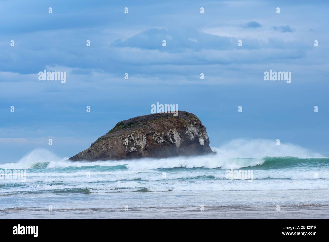 New Zealand, Otago, Ocean waves splashing against coastal stack rock ...