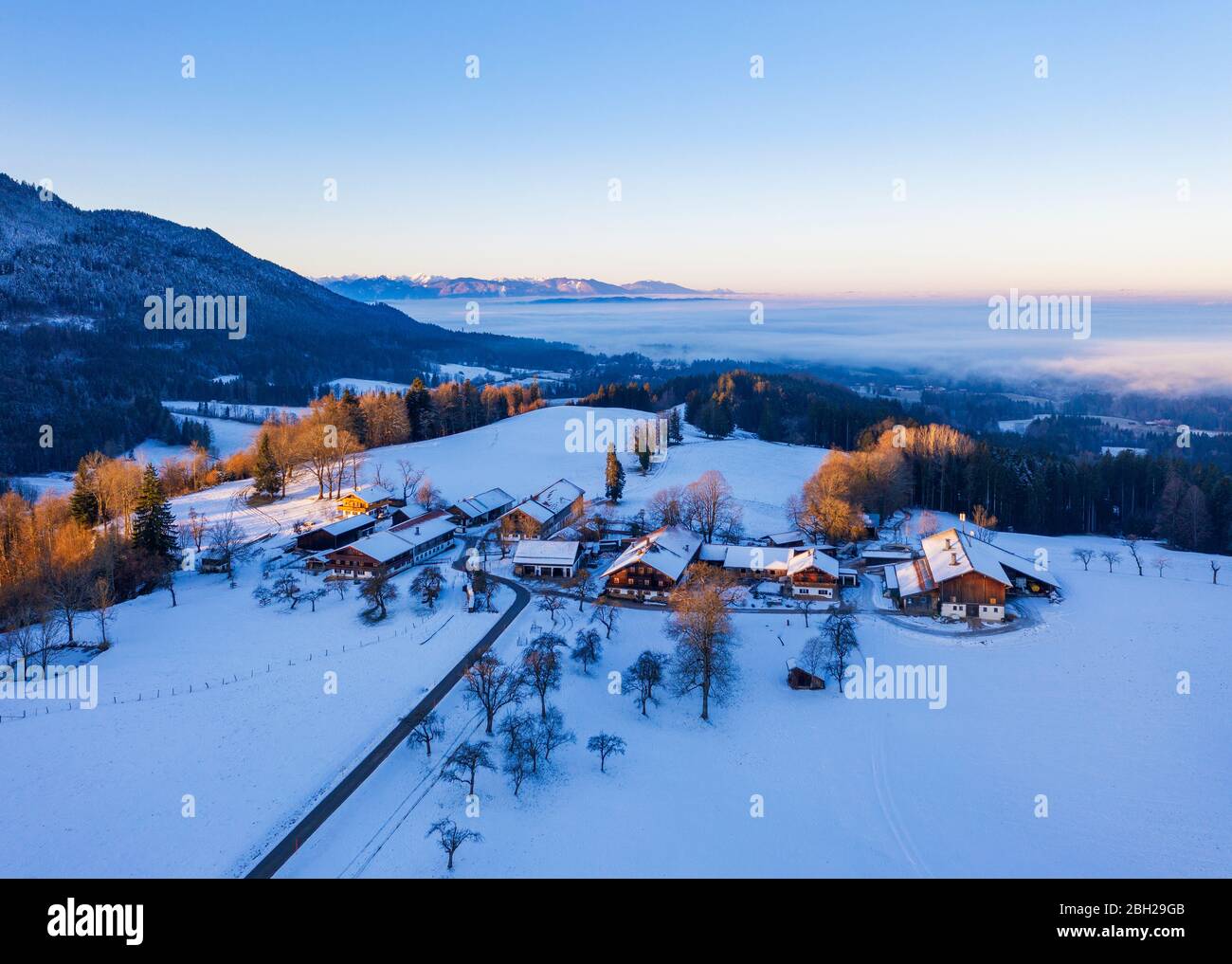 Germany, Bavaria, Buchberg, Drone view of mountain village at winter ...