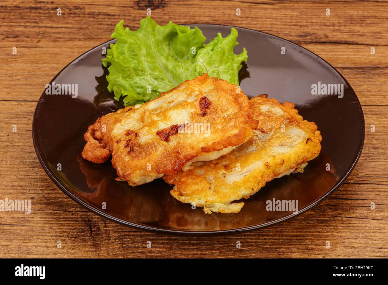Roasted cod fish in the bread Stock Photo - Alamy