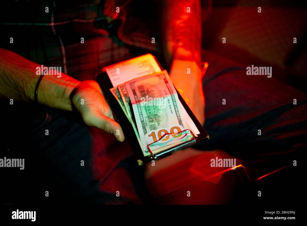 Man paying bill cash clipped on board hi-res stock photography and ...