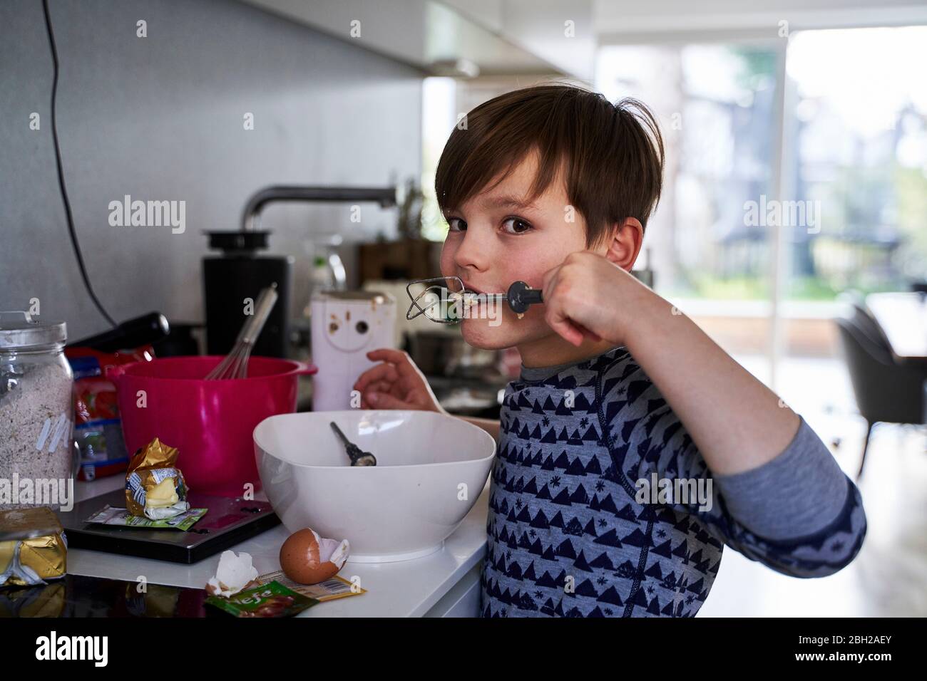 Boy Tasting Dough High Resolution Stock Photography and Images - Alamy