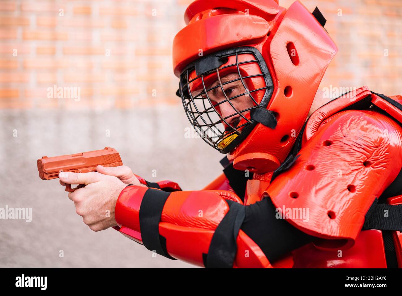 Policeman with gun hi-res stock photography and images - Alamy