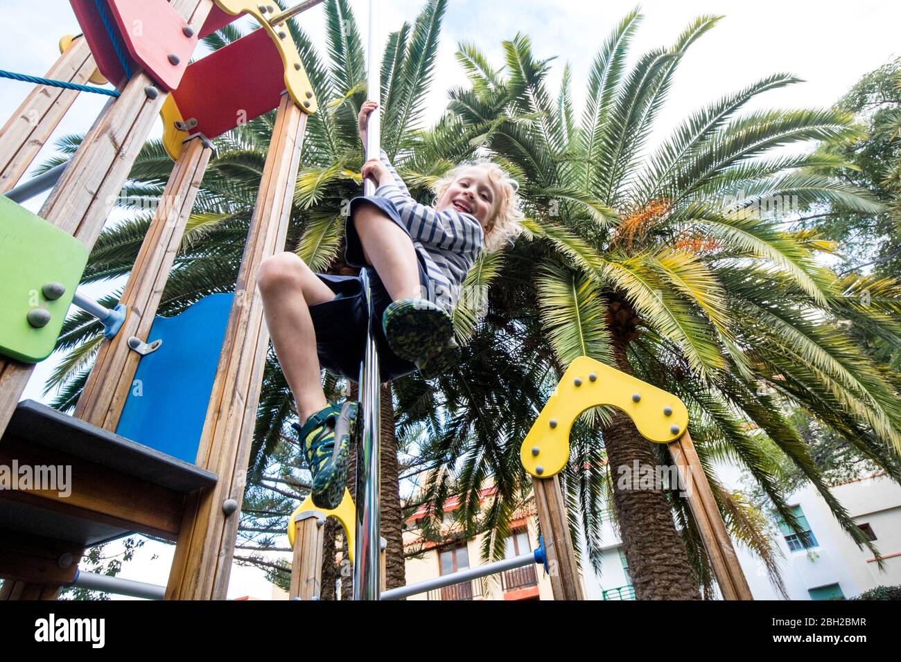 Happy little boy playing on playground, Spain Stock Photo - Alamy