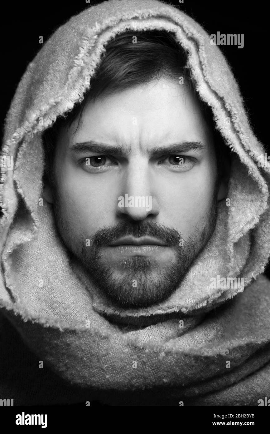 Portrait of man with scarf around his head, looking serious Stock Photo ...