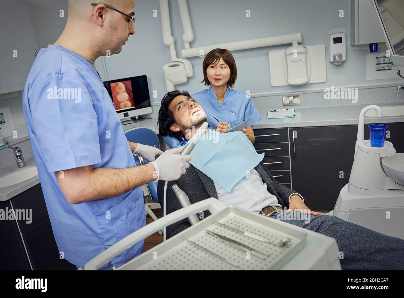 Receiving medical treatment hi-res stock photography and images - Alamy