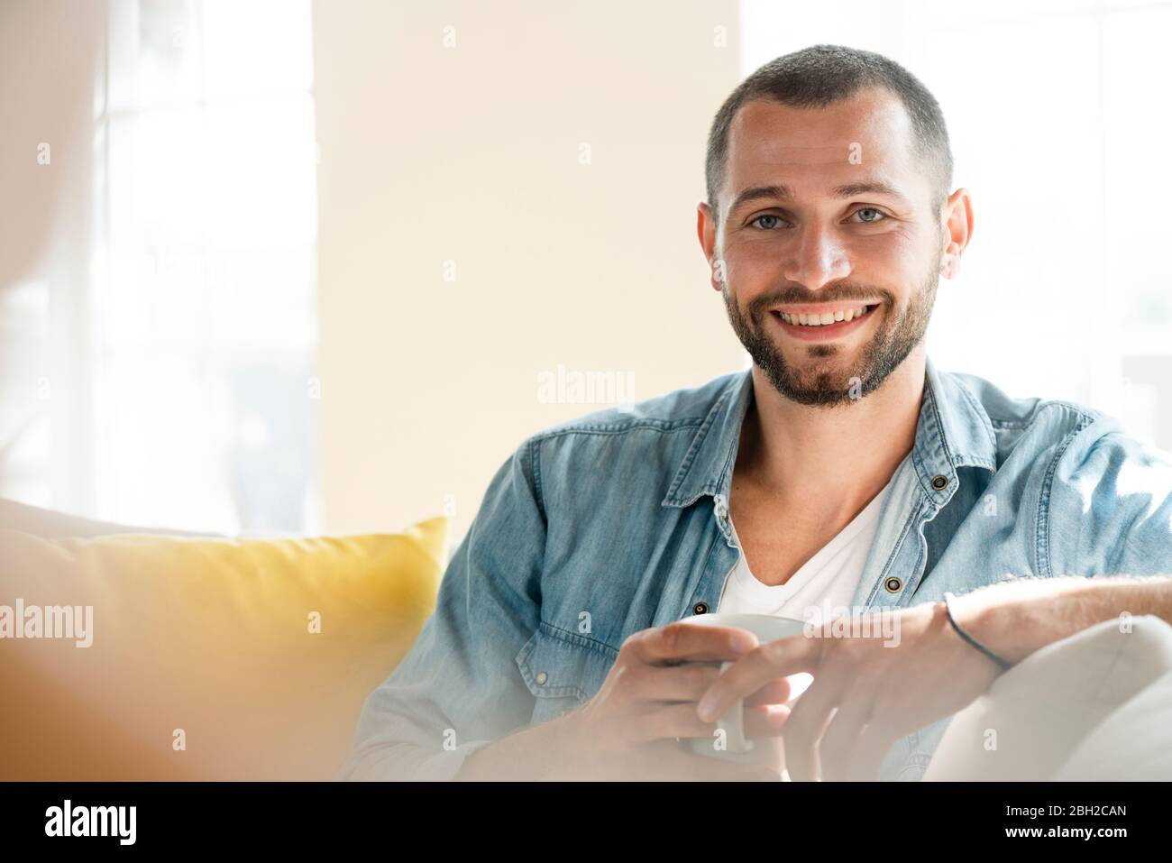 Happy man holding mug hi-res stock photography and images - Alamy