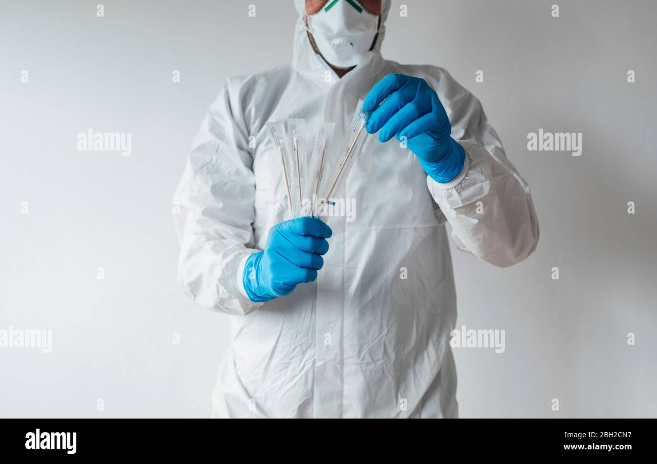 Doctor holding swab cotton sticks Stock Photo - Alamy