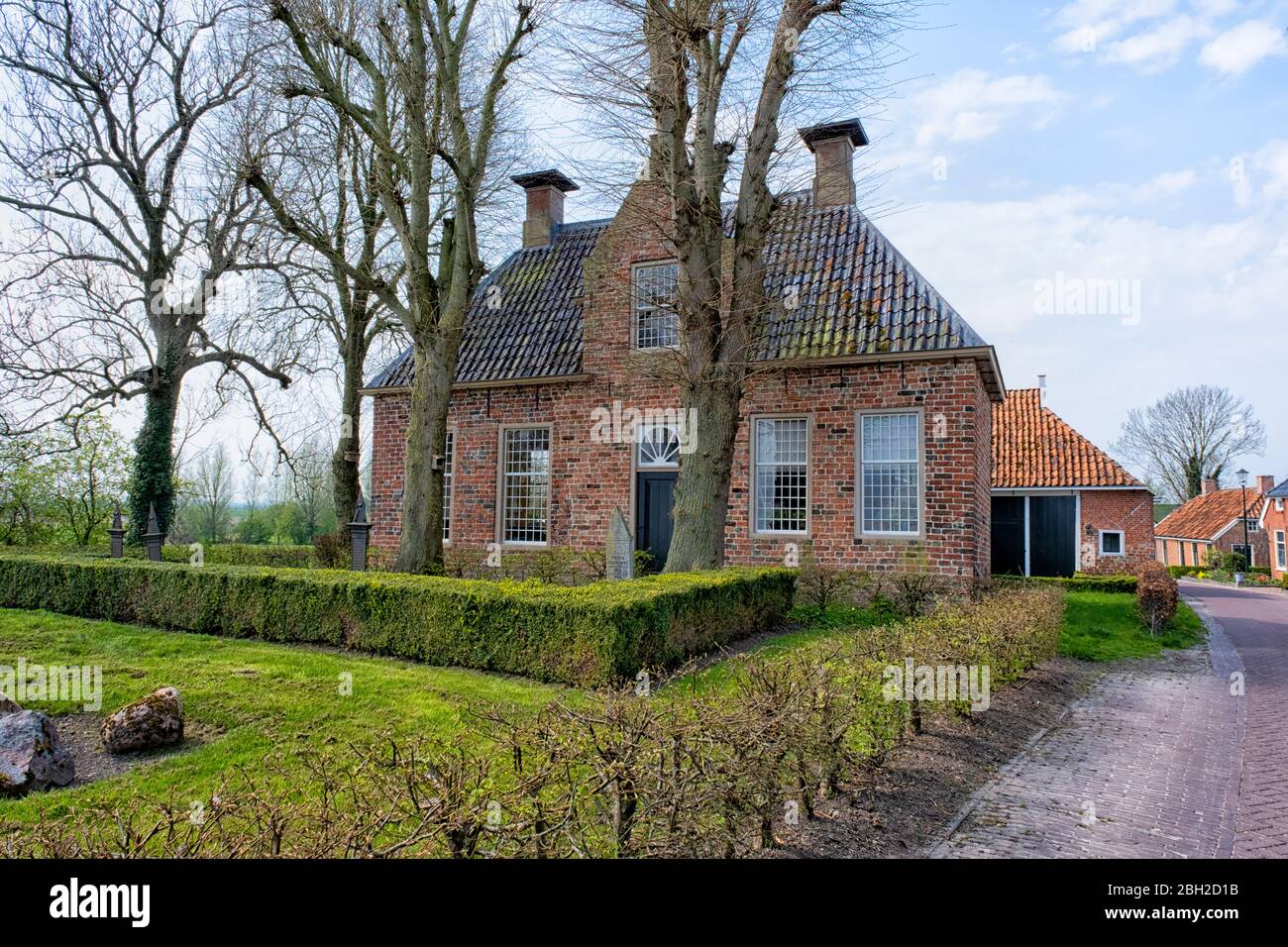 Medieval vicary and cemetery in rural Groot Wetsinge in the countryside ...