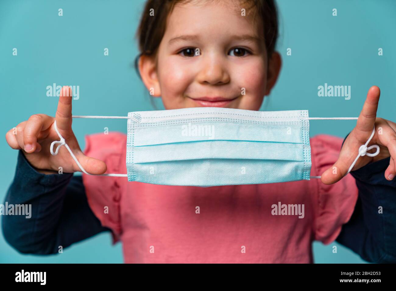 Putting a mask hi-res stock photography and images - Alamy