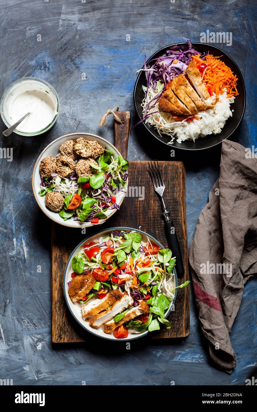 Bowls with three different ready-to-eat salads Stock Photo - Alamy