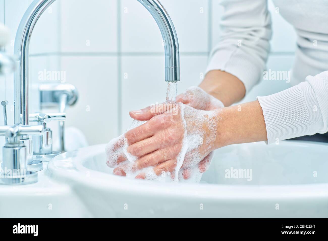 Washing with soap hi-res stock photography and images - Alamy