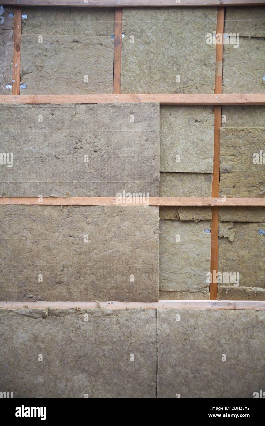 warming the walls of a stone house with a stone wool heater. Ecological ...