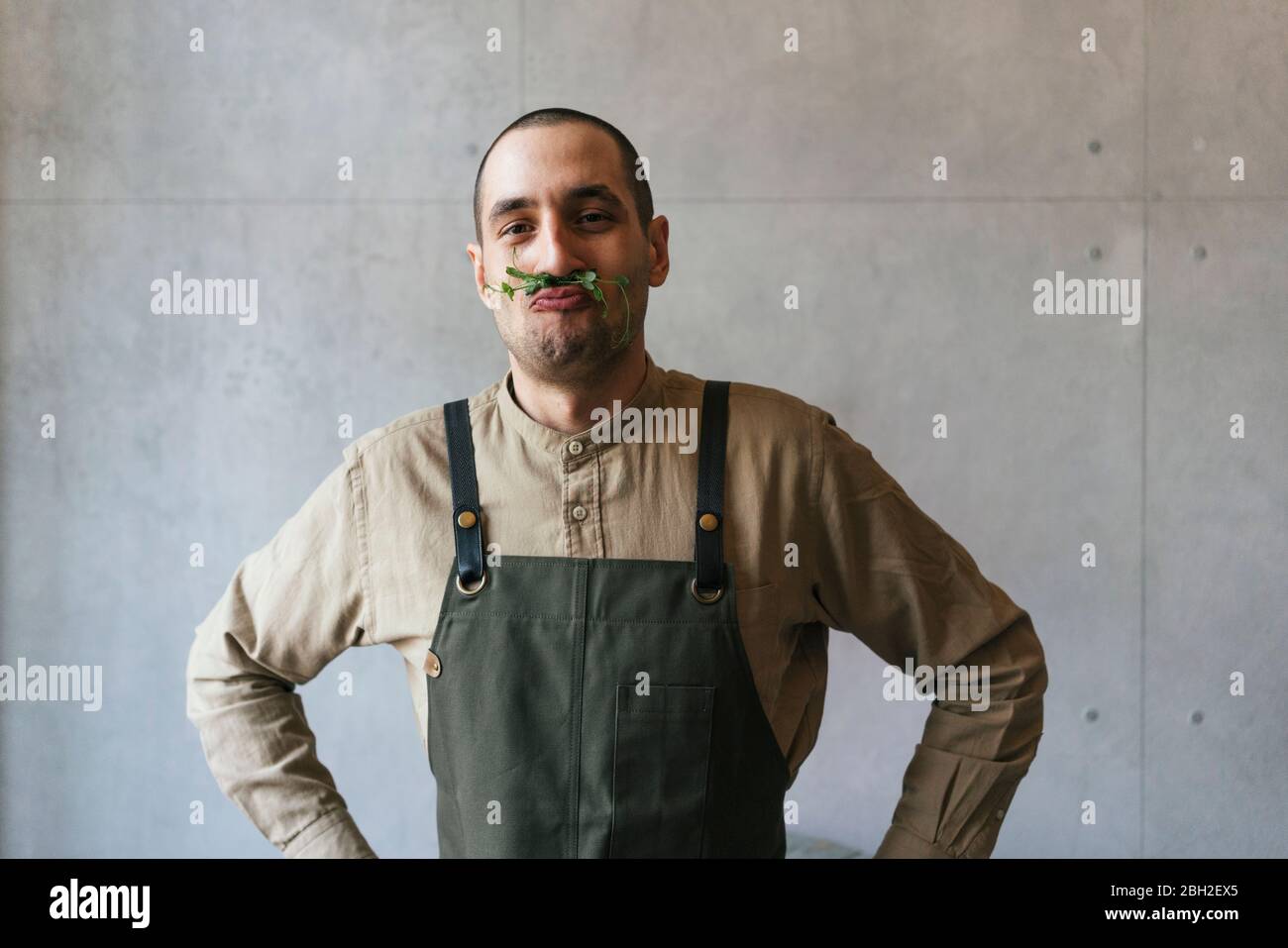 Portrait of man making nonsense with microgreen plant Stock Photo - Alamy
