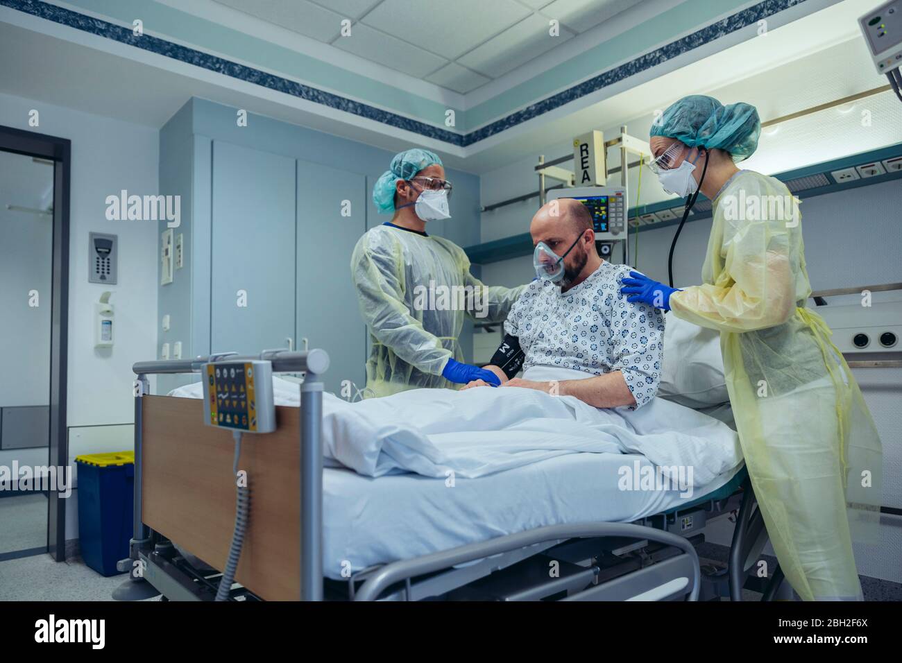 Doctors Giving Artificial Respiration To Patient In Emergency Care Unit doctors-giving-artificial-respiration-to-patient-in-emergency-care-unit