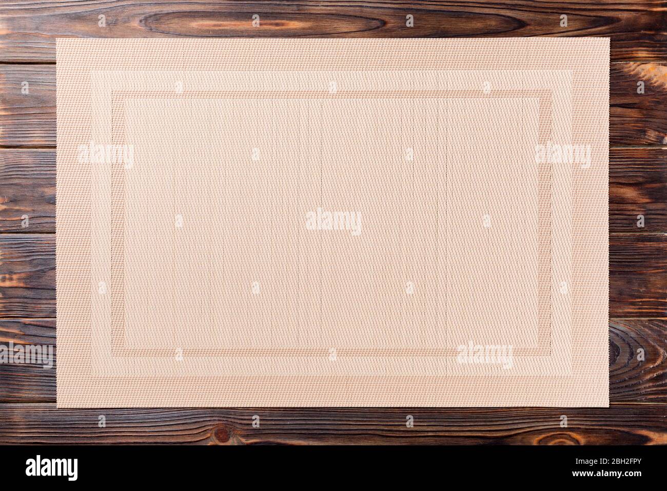 Top view of white tablecloth for food on wooden background. Empty space ...