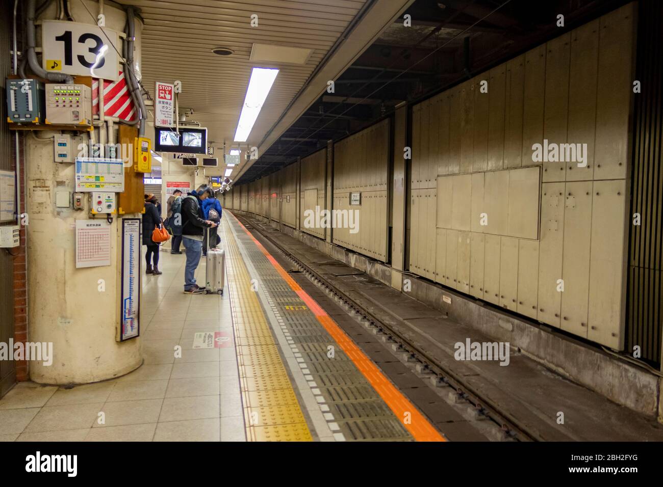 The subway platform with many passengers at Tokyo subway station. Tokyo ...