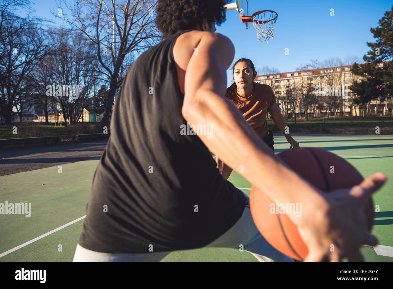 Basketball player in action on court Stock Photo - Alamy
