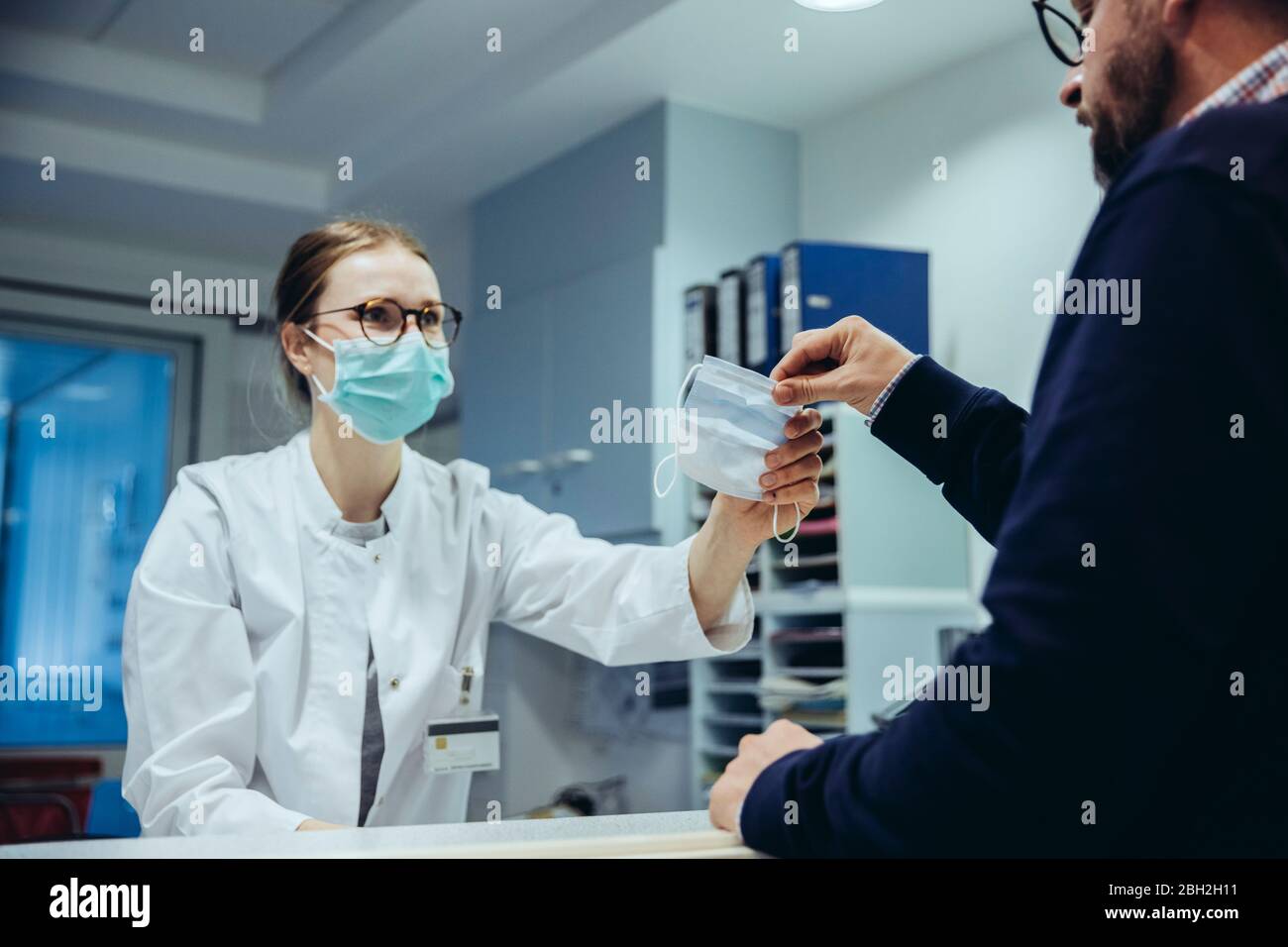 Man giving woman present hospital hi-res stock photography and images ...