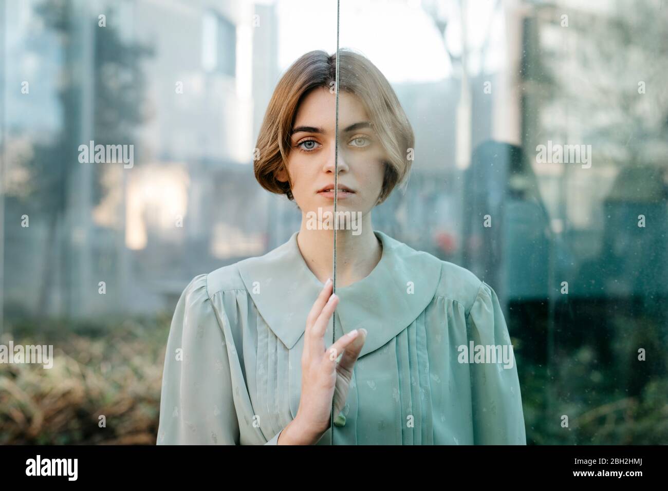 Woman face behind glass hi-res stock photography and images - Alamy