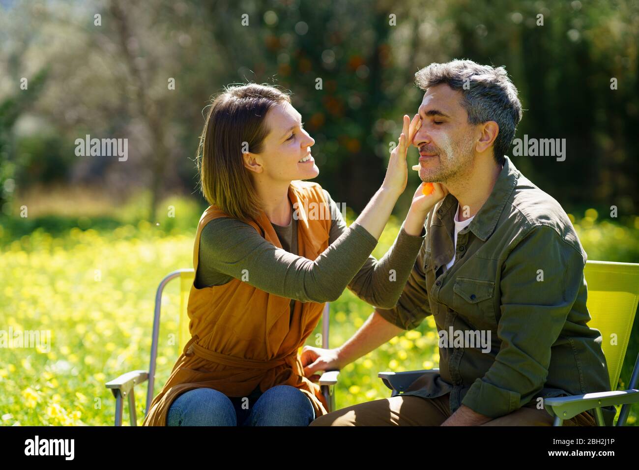 Woman putting suncream on hi-res stock photography and images - Alamy