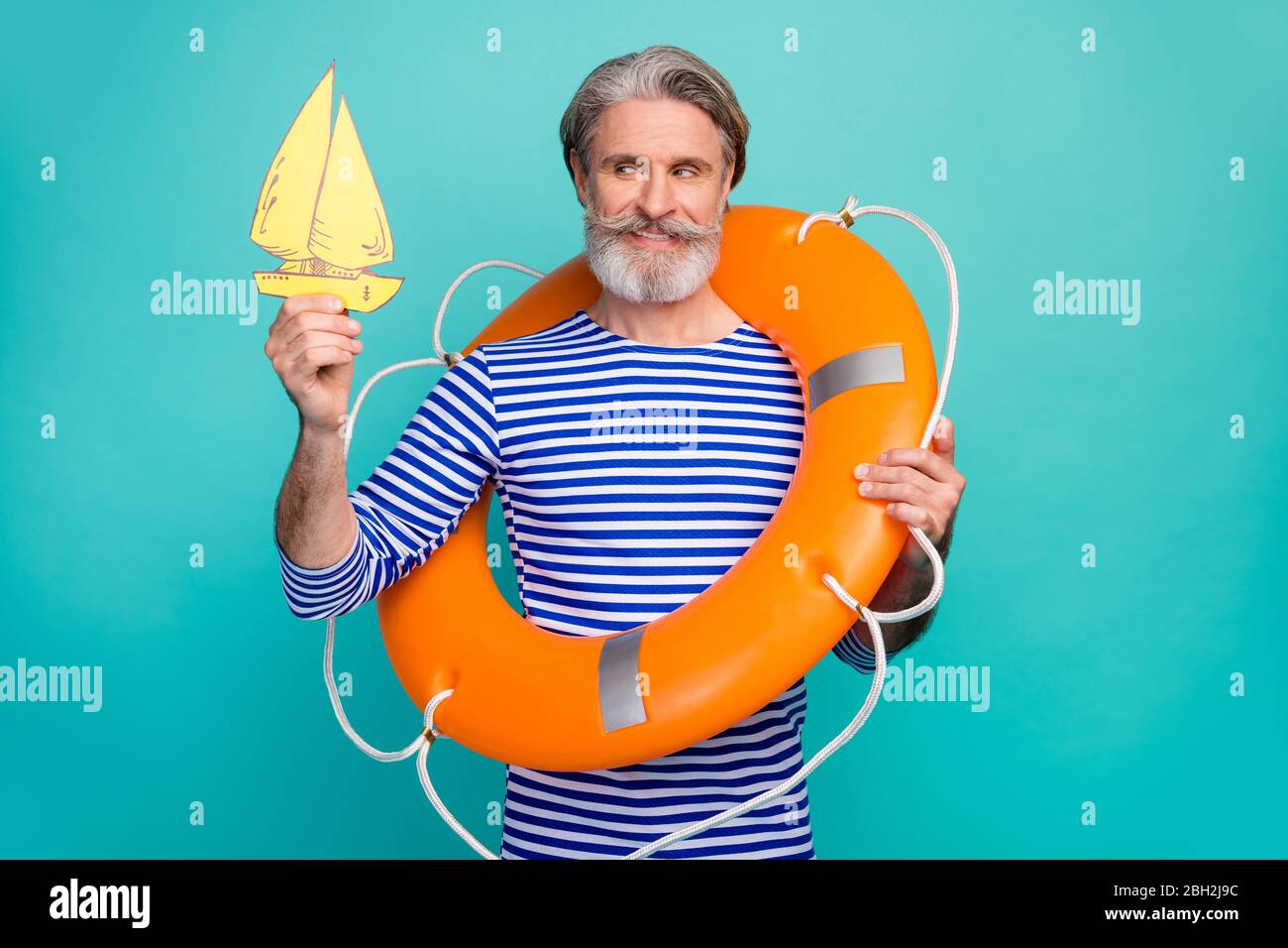 Photo of attractive trendy aged seaman hold security saving life buoy ...