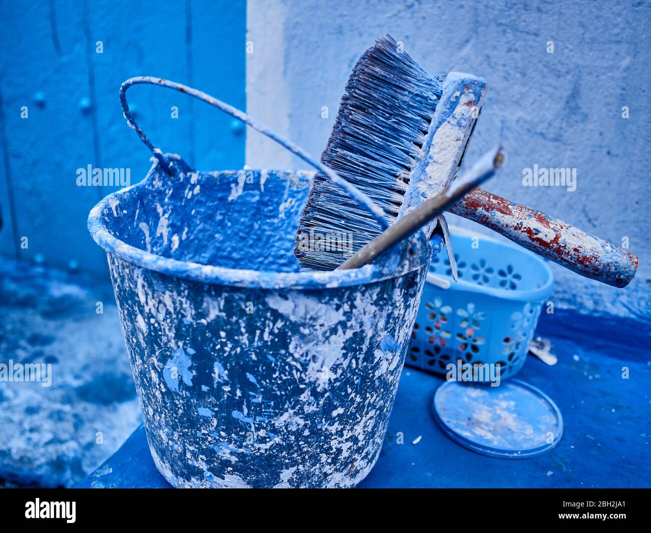 Morocco, Chefchaouen Province, Chefchaouen, Paintbrush and metal bucket ...