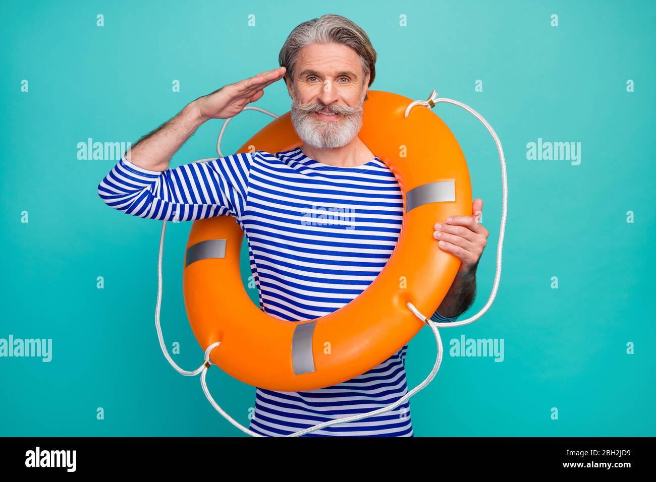 Photo of attractive handsome aged seaman security saving life buoy hold ...