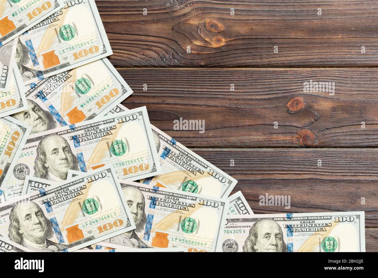 Top view banknotes on colored desk with copy space on top. one hundred ...