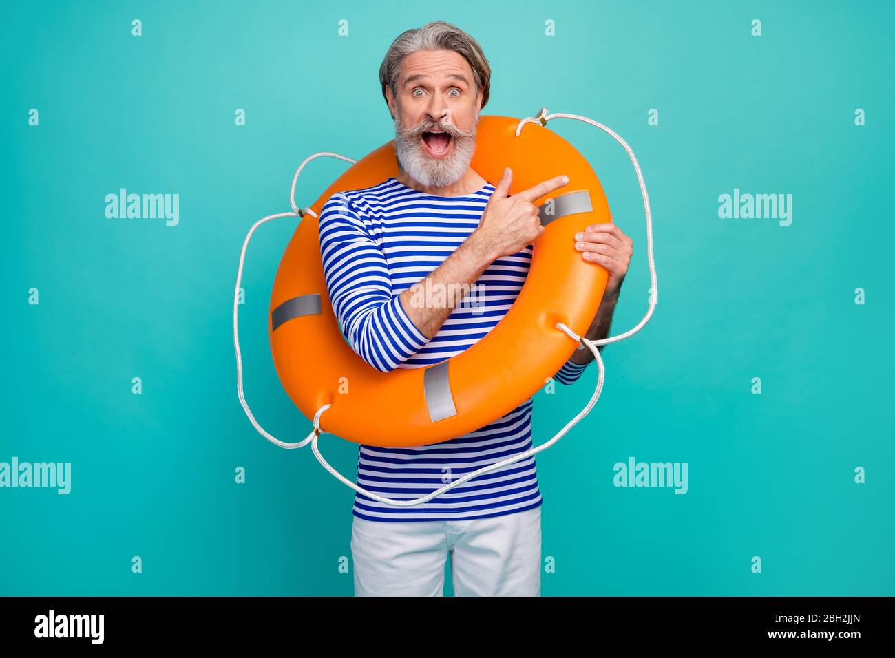 Photo of attractive aged seaman hold security saving life buoy sea ...