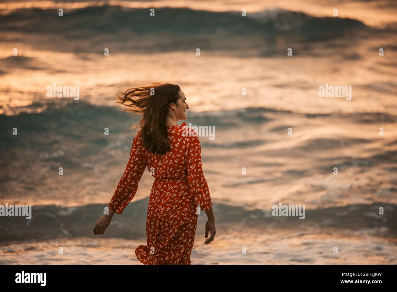 Woman at the seafront at sunrise, Miami, Florida, USA Stock Photo - Alamy