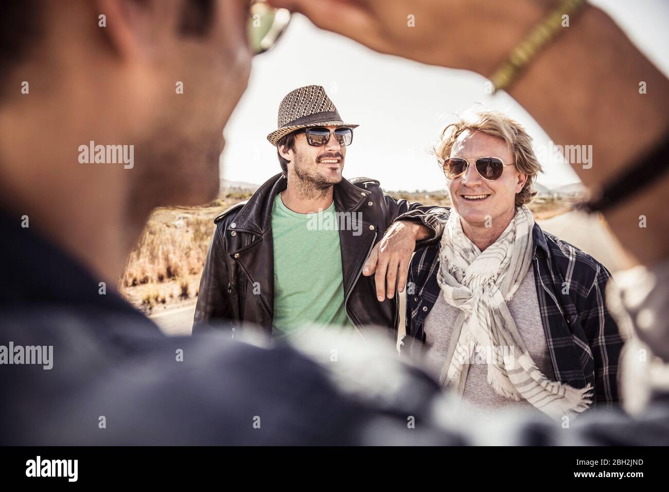 Three men talking hi-res stock photography and images - Alamy