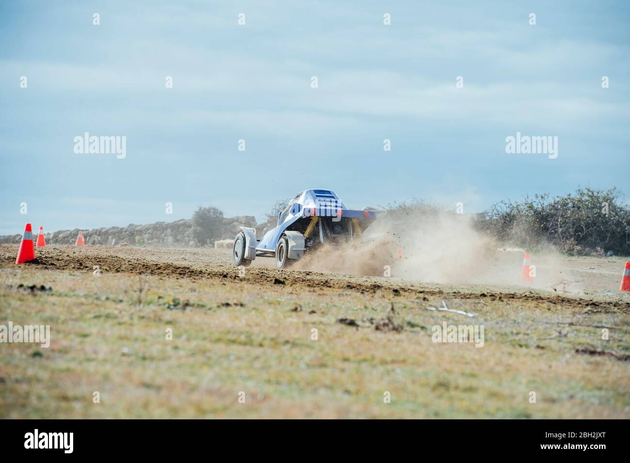 Racing car on racing track Stock Photo - Alamy