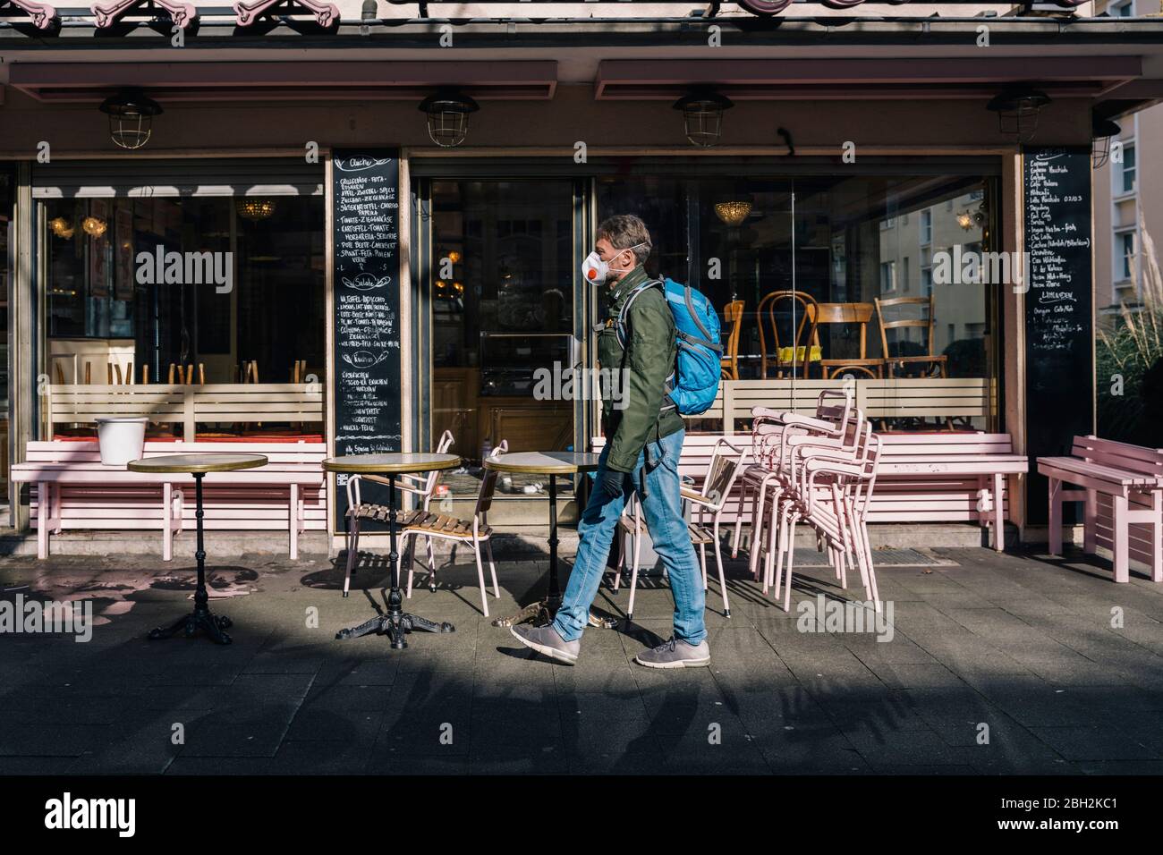 Man walking by cafe hi-res stock photography and images - Alamy